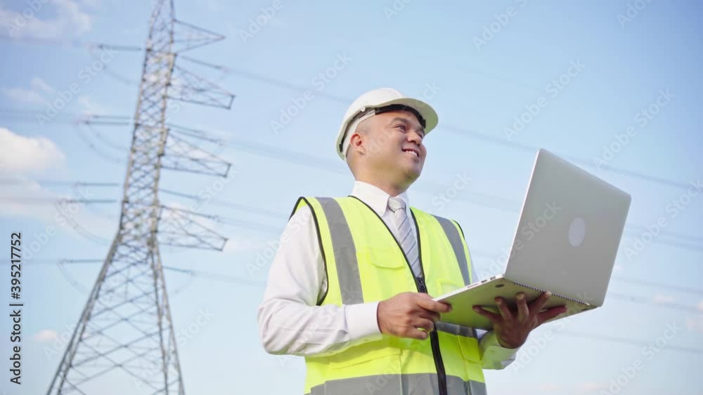 Stockvideon Vision of engineer. Smiling asian electrical engineer ...