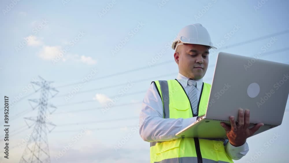 Vision of engineer. Smiling asian electrical engineer working with ...