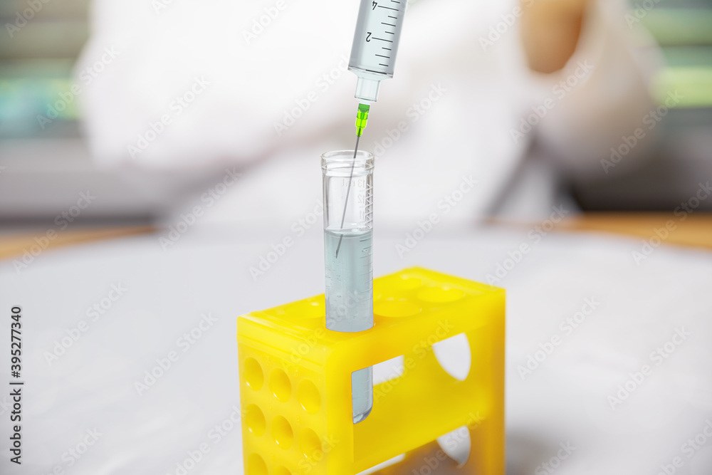 test tube syringe at laboratory Stock Photo | Adobe Stock