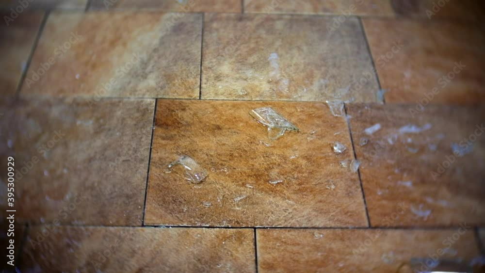Video „A glass bottle falls to the ground and smashes. The smashed ...