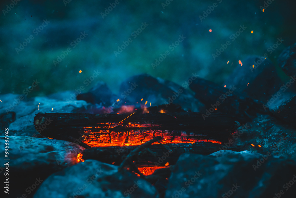 Vivid smoldered firewoods burned in fire close-up. Atmospheric warm ...