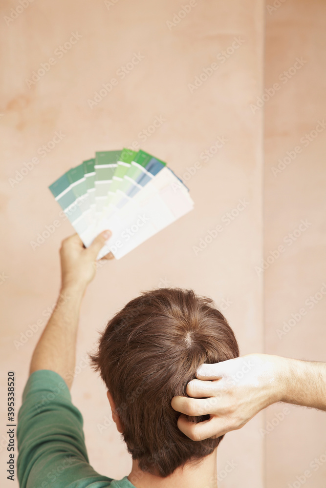 Man Choosing Color From Swatches Stock Photo | Adobe Stock