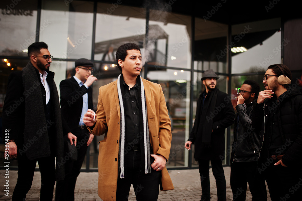 Group of handsome retro well-dressed man gangsters smoking outdoor ...