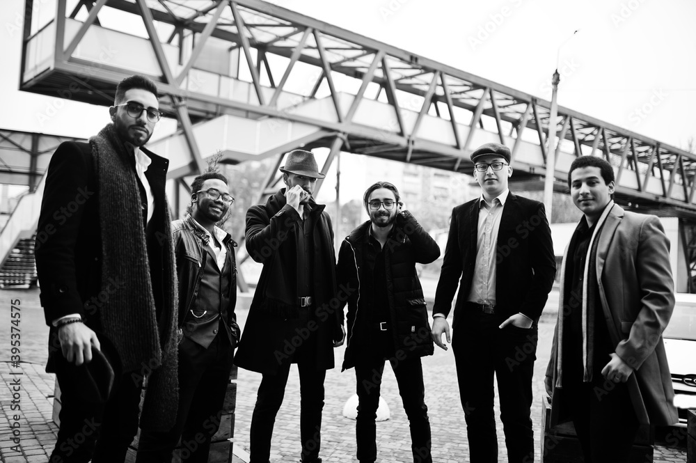 Group of handsome retro well-dressed man gangsters smoking outdoor ...