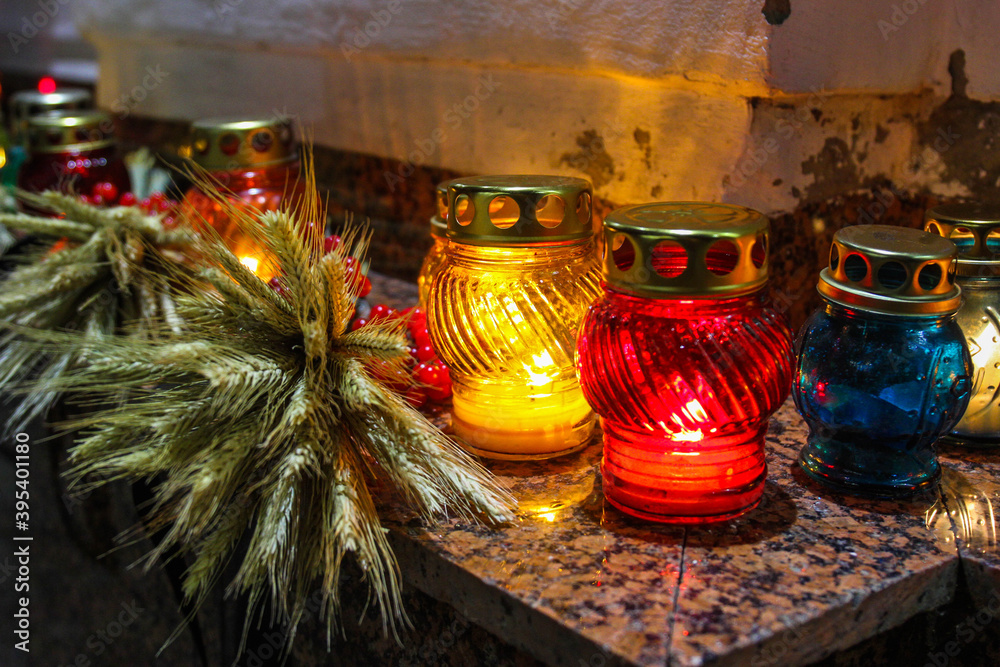 A bunch of grain and lighted lamps of fire (symbol of Ukrainian famine ...