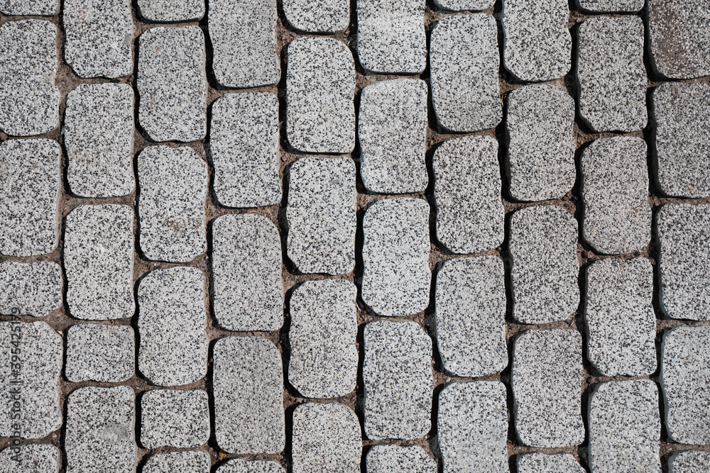 Granite pavement texture. Beautiful masonry with uneven granite blocks ...
