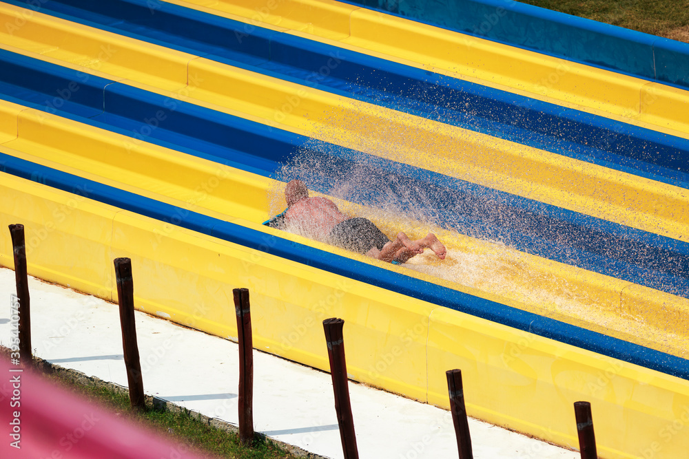 Water park adventure aqua park with cool people having fun on the water ...