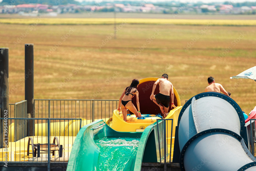 Water park adventure aqua park with cool people having fun on the water ...