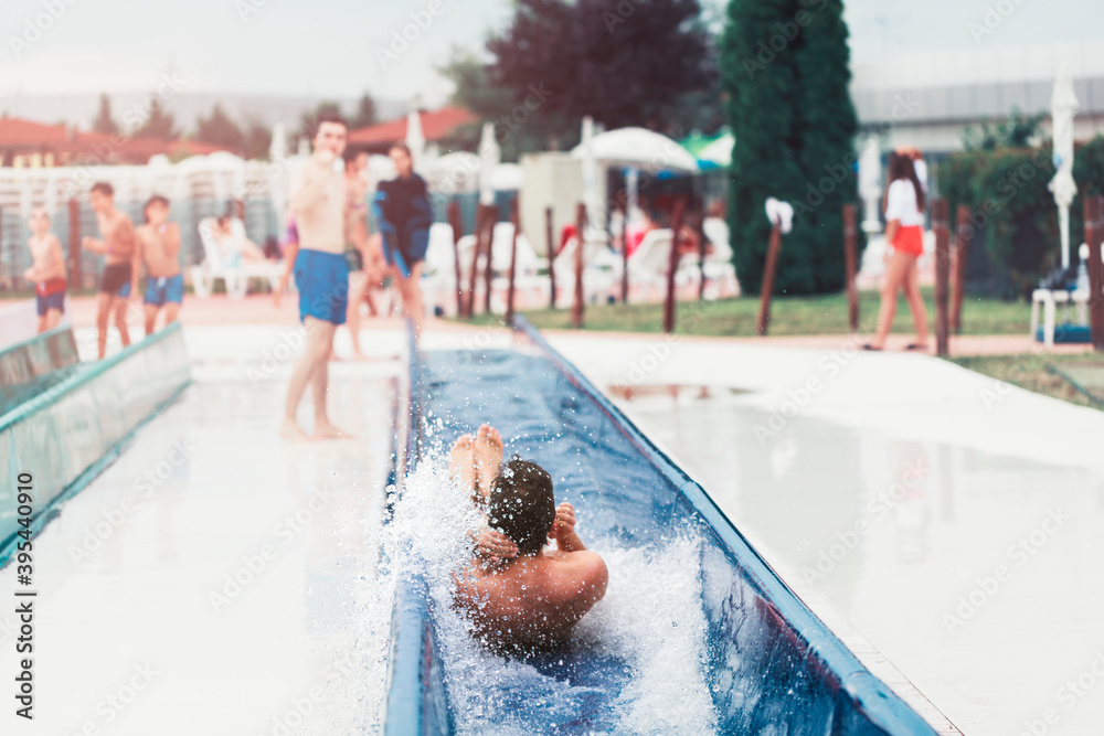 Water park adventure aqua park with cool people having fun on the water ...