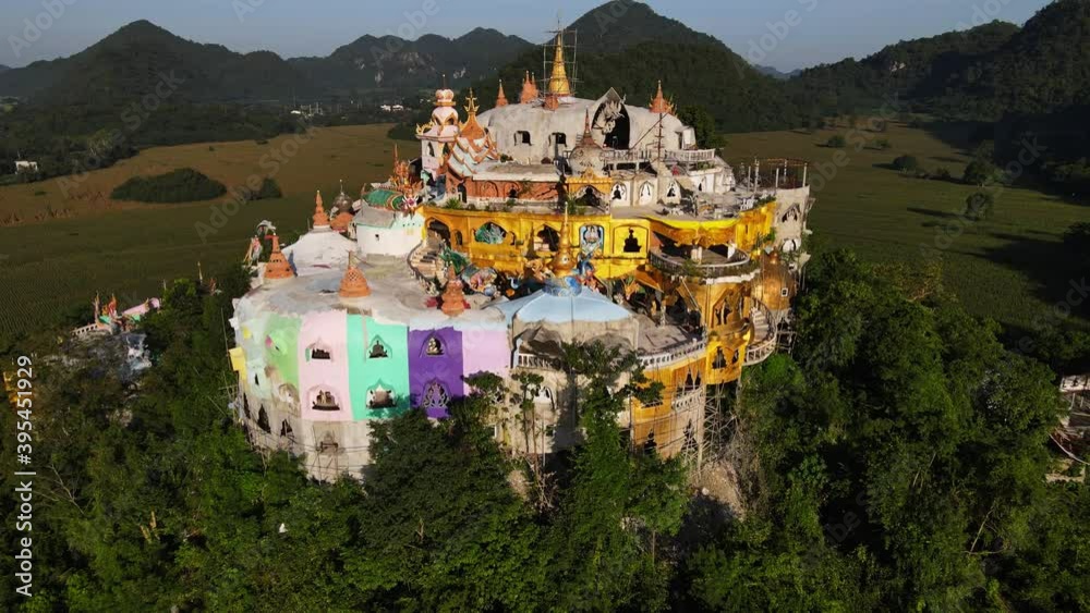 Brightly colored temple on top of the hill. 4k revealing drone footage ...