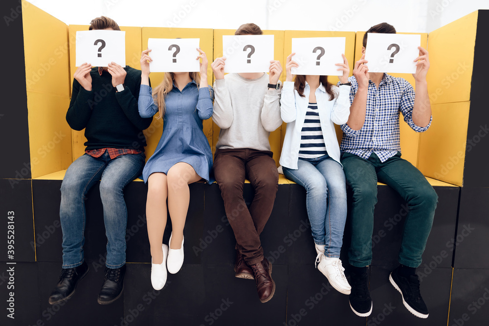 Group of people holding question mark sign. Stock Photo | Adobe Stock