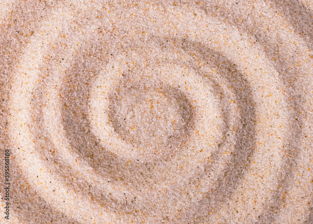 Circles in the form of a snail in the sand.Abstract background of ...
