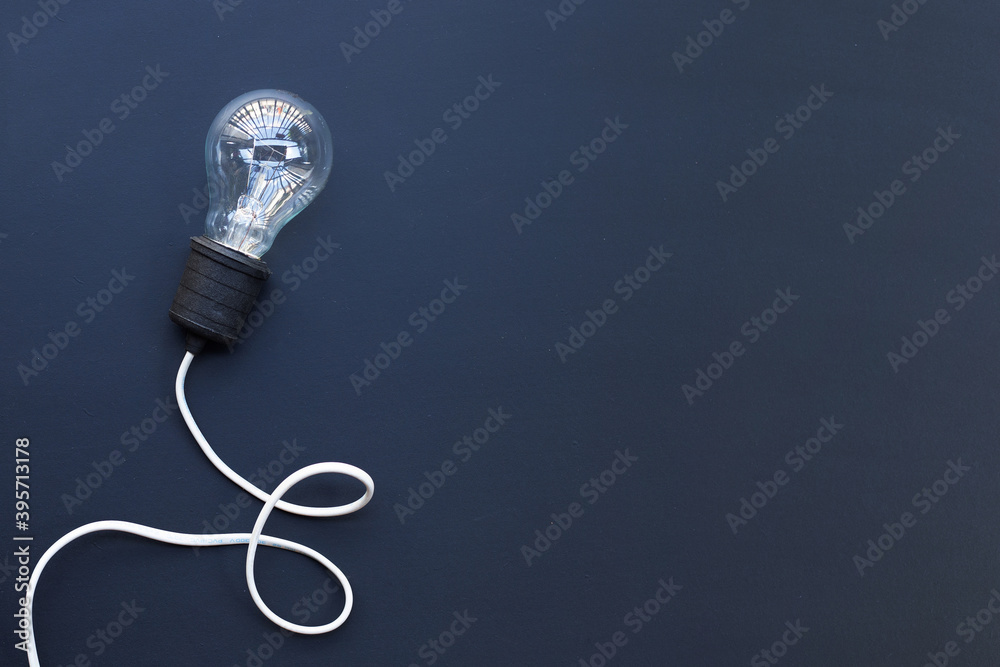 Light bulb on dark background. Ideas and creative thinking concept. Top ...