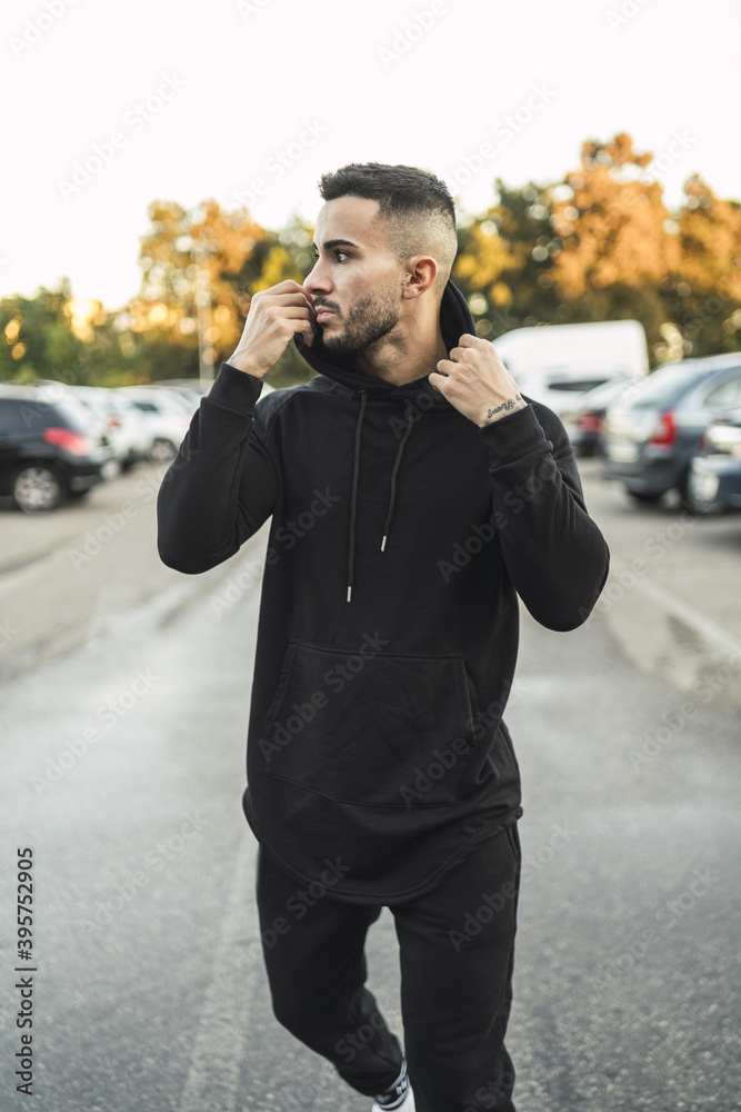 Street style of a European elegant man with a stylish haircut and beard ...