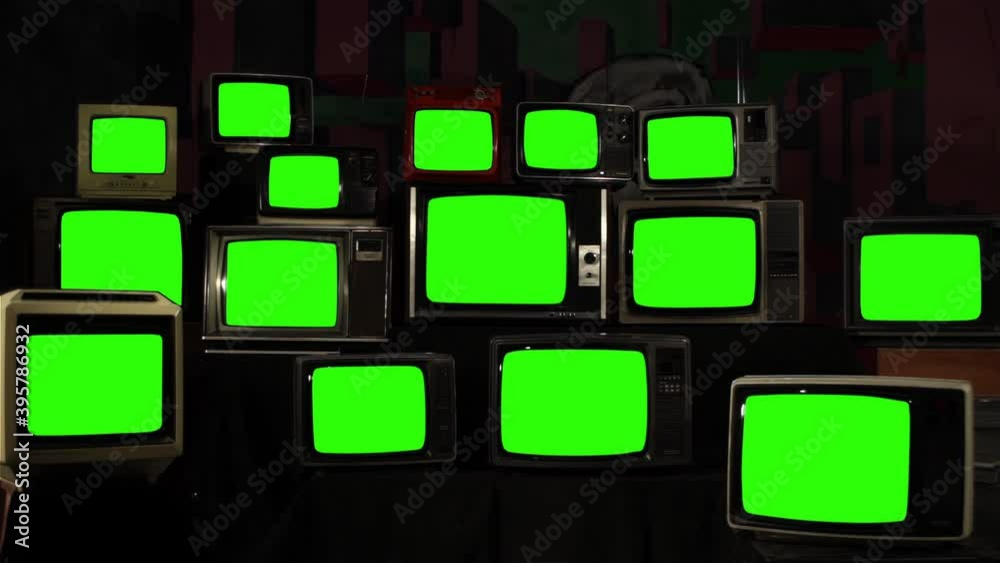 Vídeo do Stock: Stack of Retro Television Sets Turning On Green Screens ...