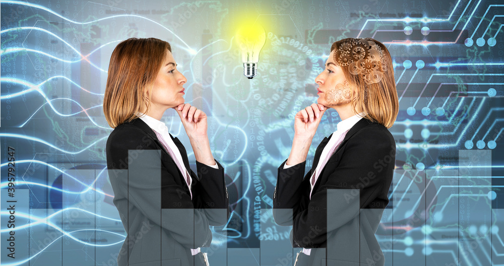 Young and attractive business woman and clone robot are thinking over ...