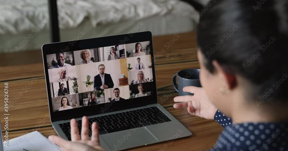 Focus on computer screen with diverse business people involved in video ...