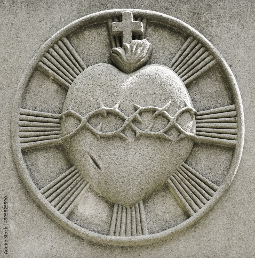 stone heart covered with thorn branch as symbol of Jesus Christ ...