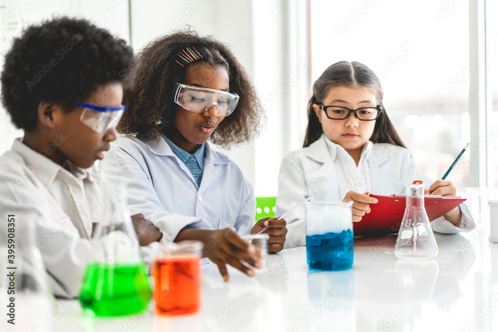 Group of teenage cute little students child learning research and doing ...