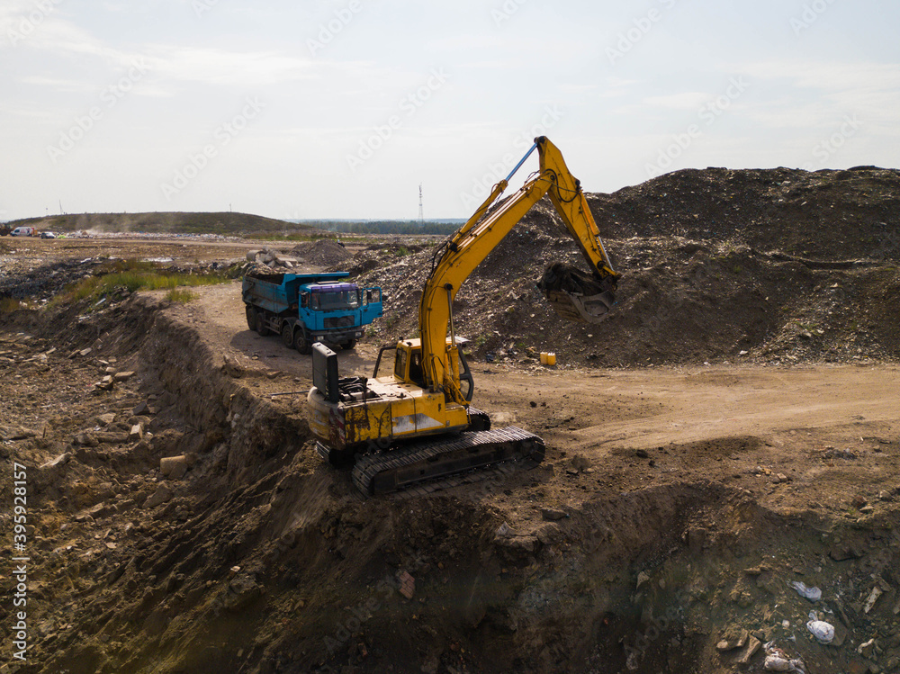 Construction works. Earthmoving at open pit mining. Heavy equipment ...
