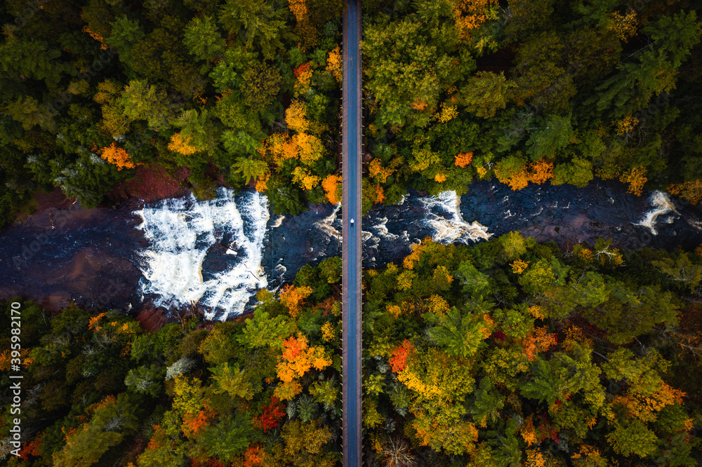 Beautiful autumn look down travel aerial of a man laying down on the ...