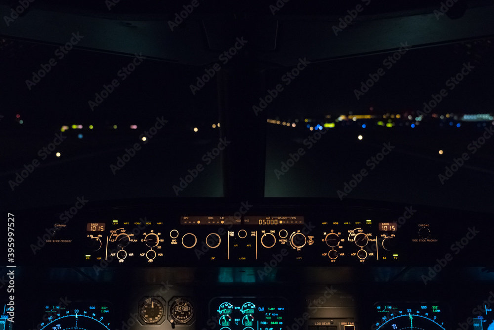 Aircraft cockpit flight deck at night on runway Stock Photo | Adobe Stock