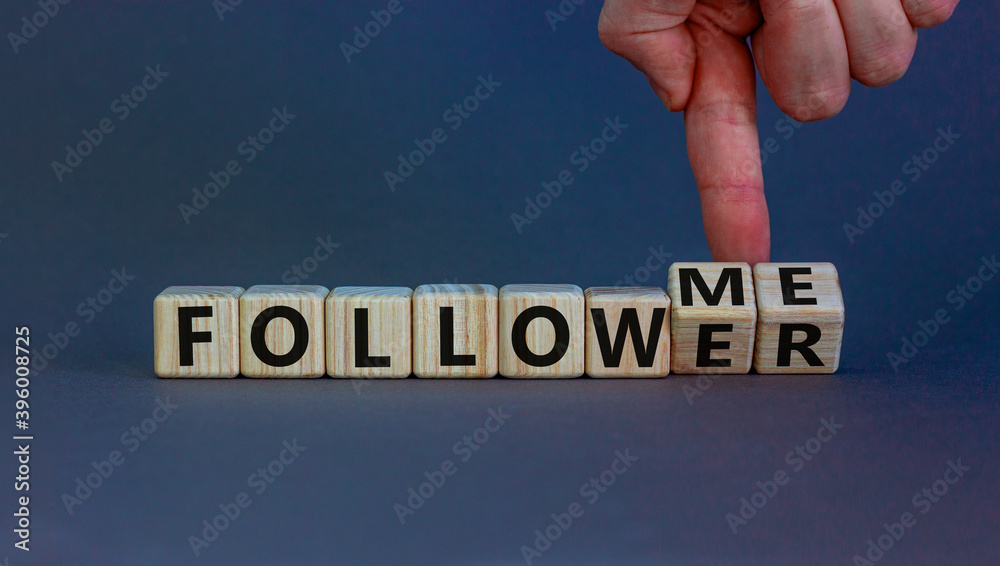 Follow me. Male hand turns wooden cubes and changes the words 'follower ...