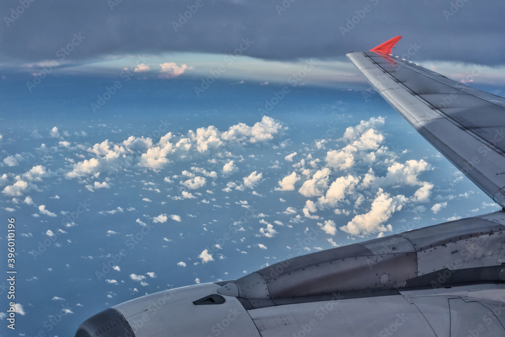 The passenger plane transports passengers in the air, looking out from ...