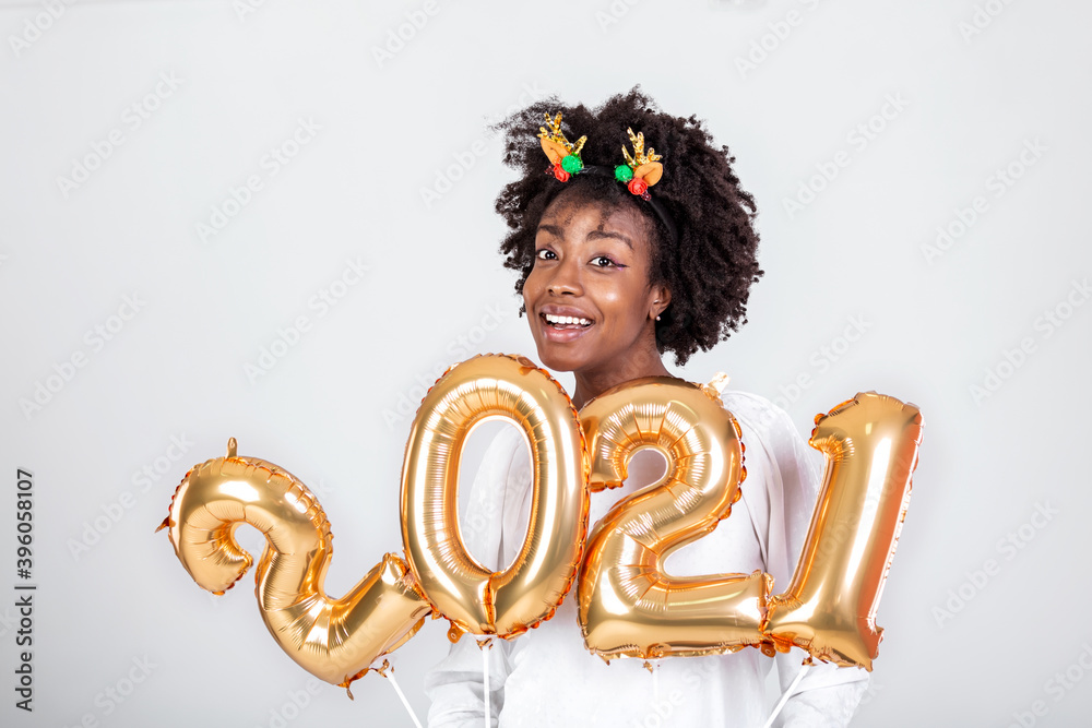 Young beautiful African reindeer horns on her head holding balloons ...
