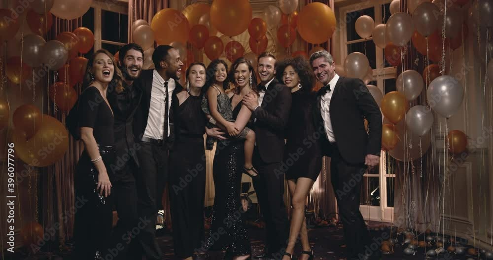 Family and friends having a group photo at gala night party with ...