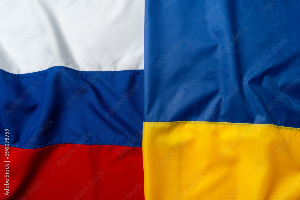 Flags of Russia and Ukraine folded together Stock Photo | Adobe Stock