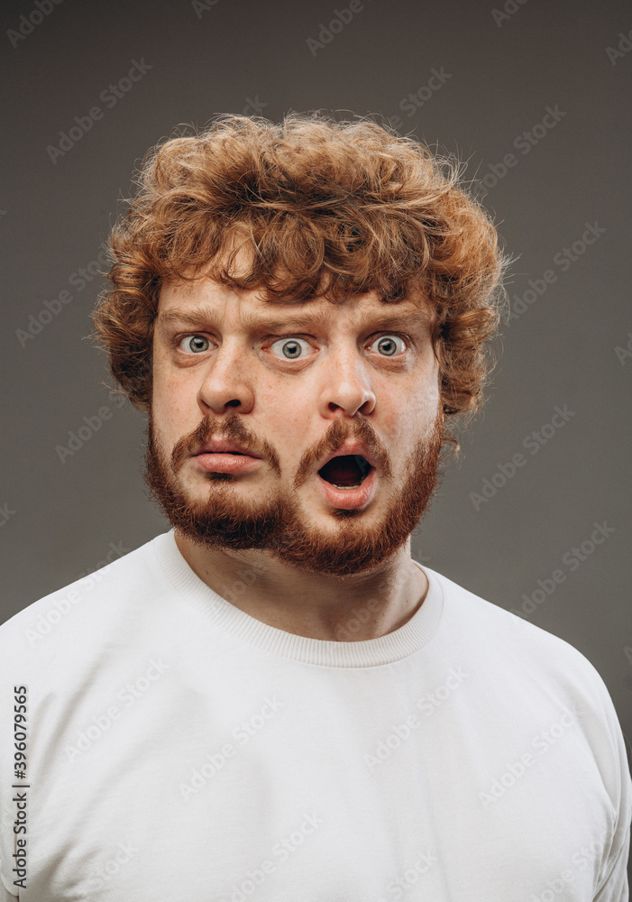 Shocked, amazed. Young man with dual emotions combination on face ...