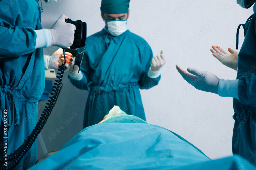 Surgical team or doctor and staff have vivisection in surgery room of ...