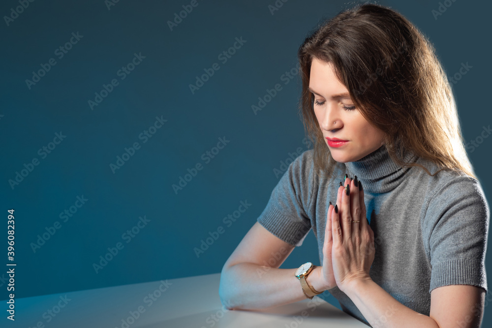 Сhristian prayer. Portrait of a girl reading a Christian prayer. Woman ...