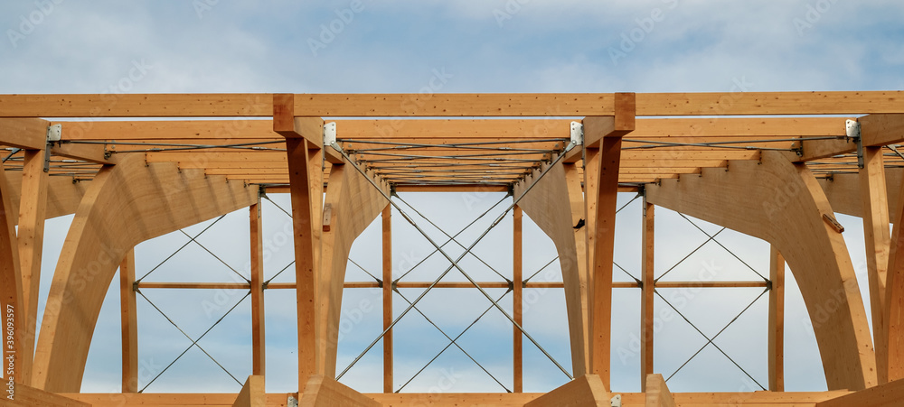 Detail of a modern wooden architecture in glued laminated timber on a ...