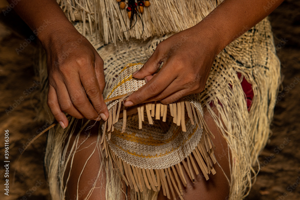 Hands of indigenous woman from the Huitoto tribe of the Colombian ...
