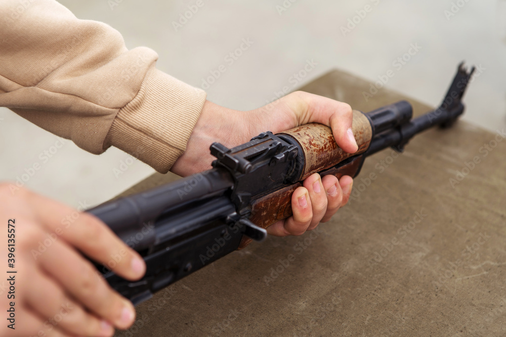 Firearms. The process of teaching young soldiers to assemble and ...