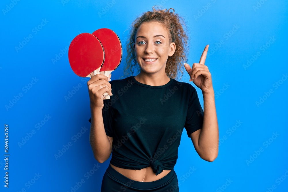 Beautiful Caucasian Teenager Girl Holding Red Ping Pong Rackets