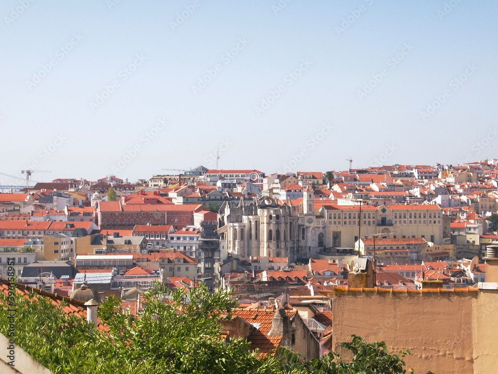 Lisbon city scape with buildings with red roofs and a cathedral on a ...