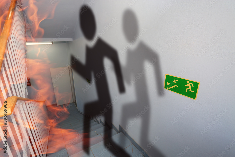 emergency exit and person symbol escaping from fire symbol Stock Photo ...