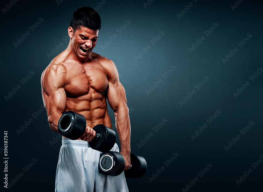 Muscular Handsome Men Lifting Weights. Bodybuilder performing Dumbbell ...
