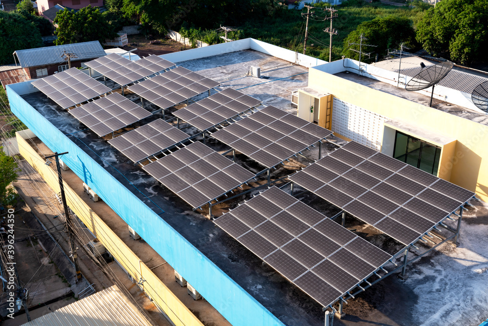 Solar panels or Solar cells on building rooftop or terrace with sun ...