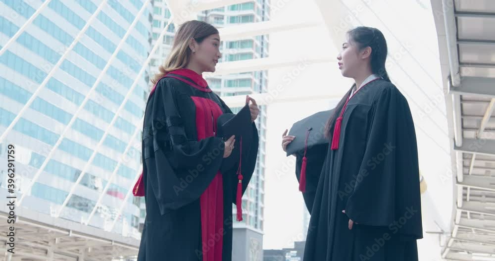 2 Student wearing graduation jacket celebrate success their learning at ...