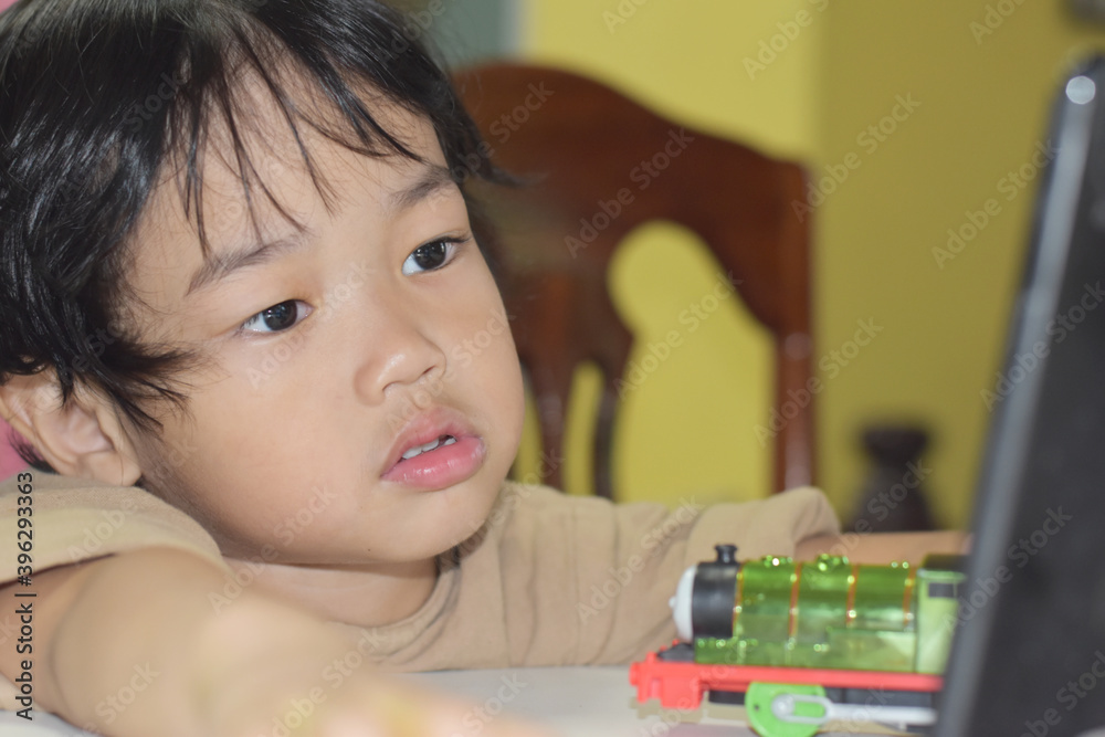 Asian cute boy look at smartphone Stock Photo | Adobe Stock