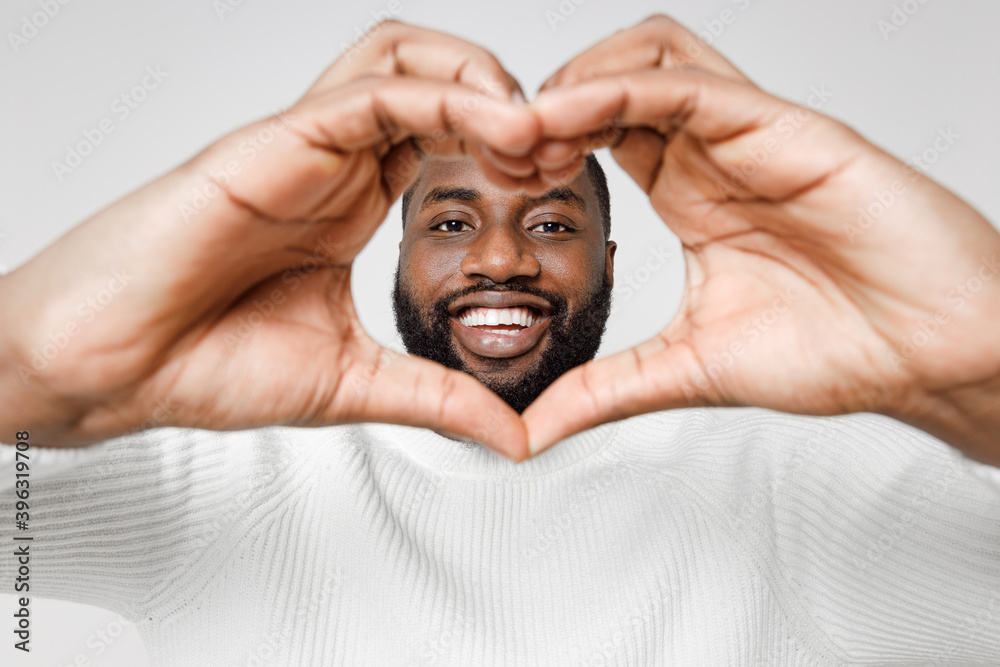 Smiling young african american man 20s wearing casual basic sweater ...