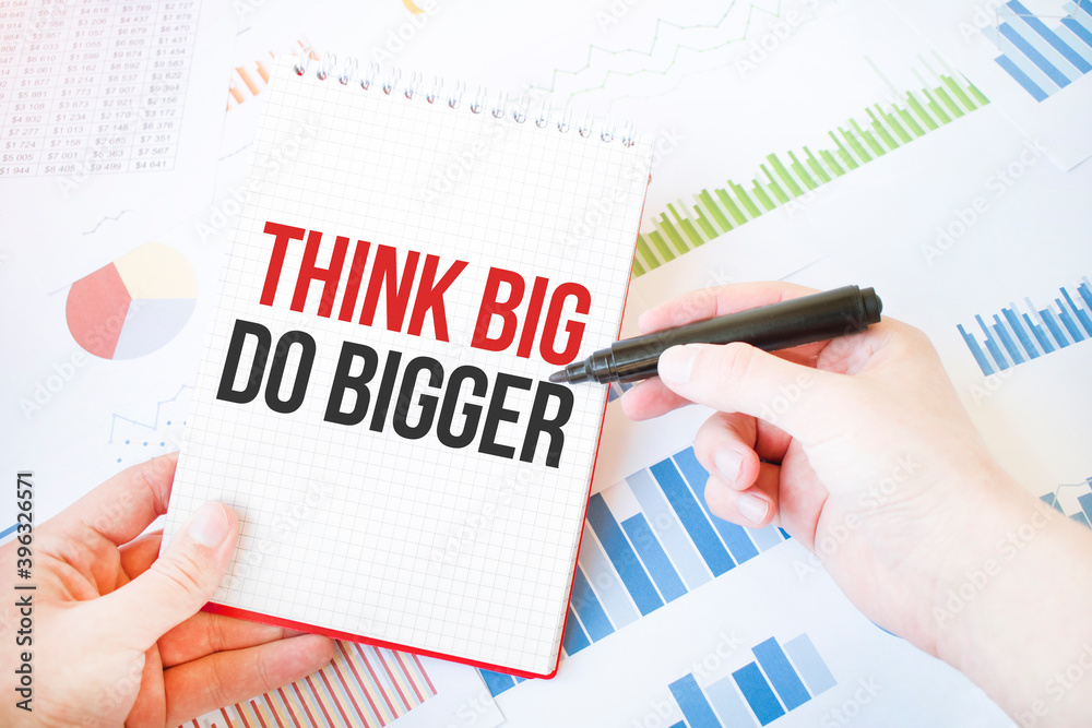 Notepad with text Think Big Do Bigger. Diagram and white background ...