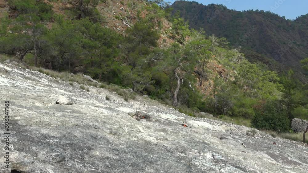 Flame of Methane Underground Emerges From Crack Between Rocks and Burns ...