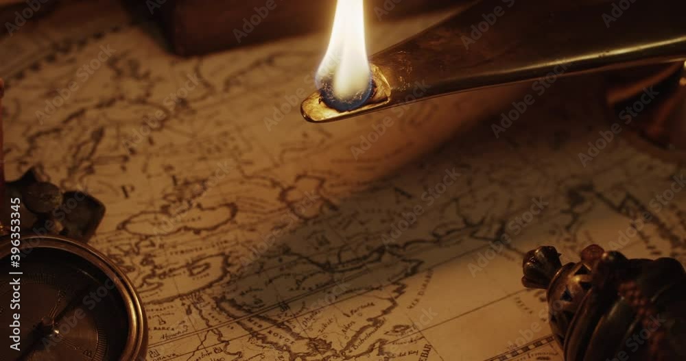 Ancient map of the XVII century illuminated by oil lamp vídeo do Stock ...