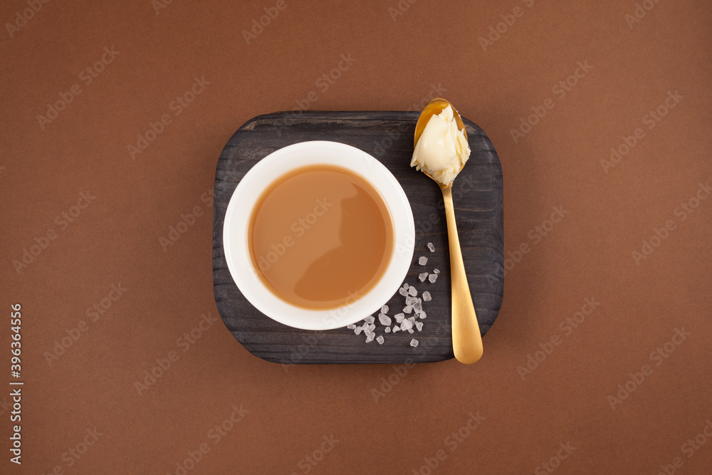 Traditional Tibetan butter tea or churned tea in white bowl. Asian ...