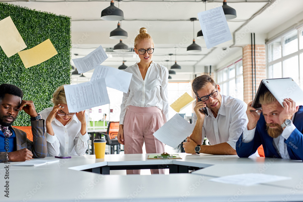 angry unbalanced female boss scream, scolds employees for not ...